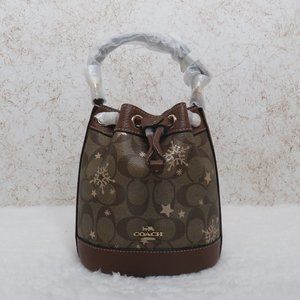 Coach | Bags | Coach Dempsey Star Snowflake Print Drawstring Bucket Bag ...